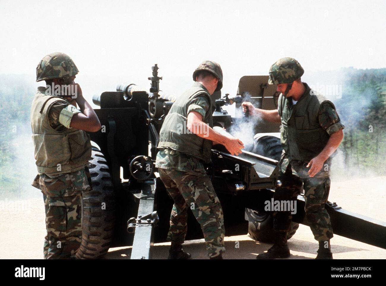 A left rear view of a 105mm howitzer gun section from the Artillery ...