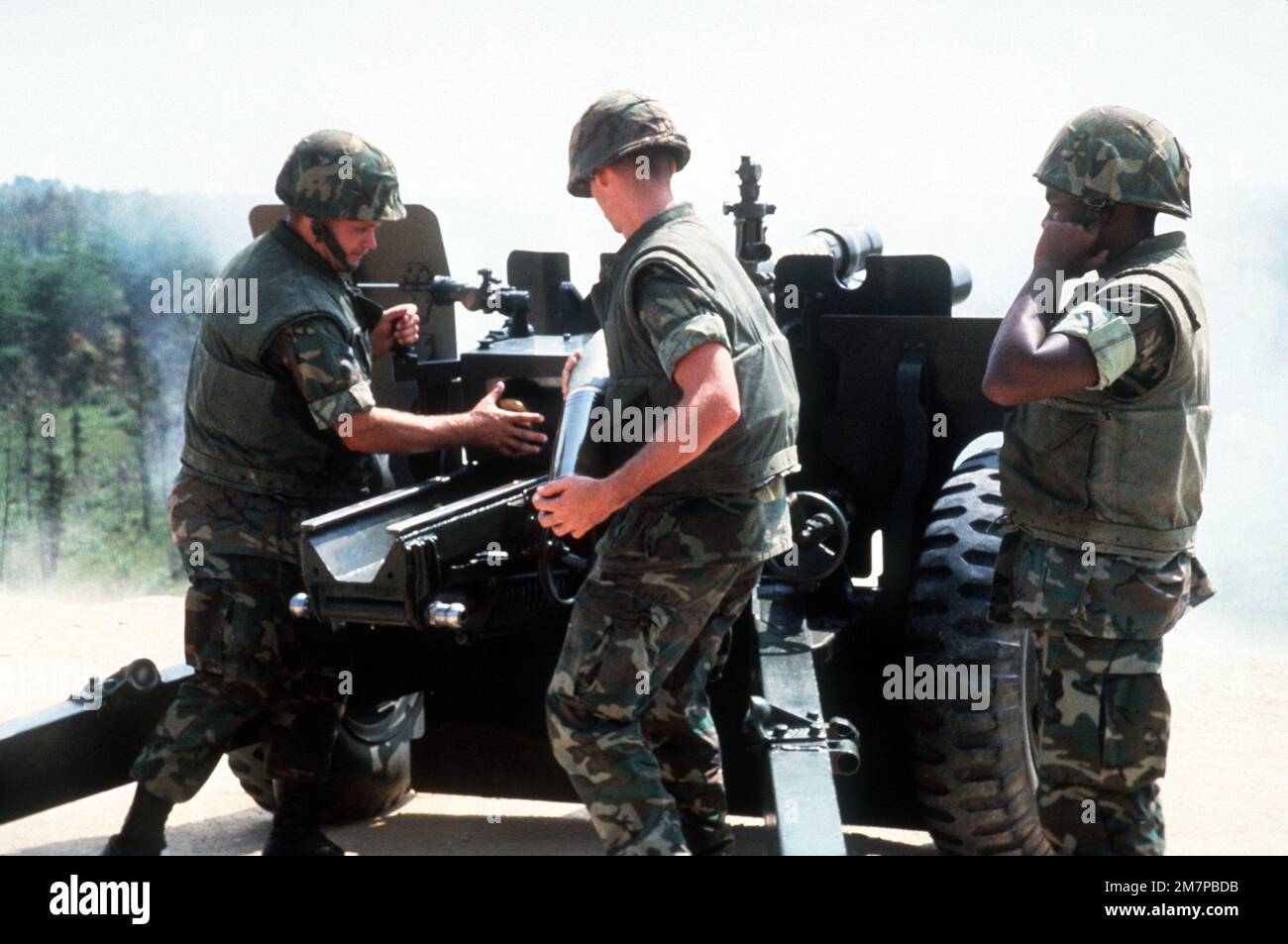 Right rear view of an M-102 105mm howitzer gun section from the ...