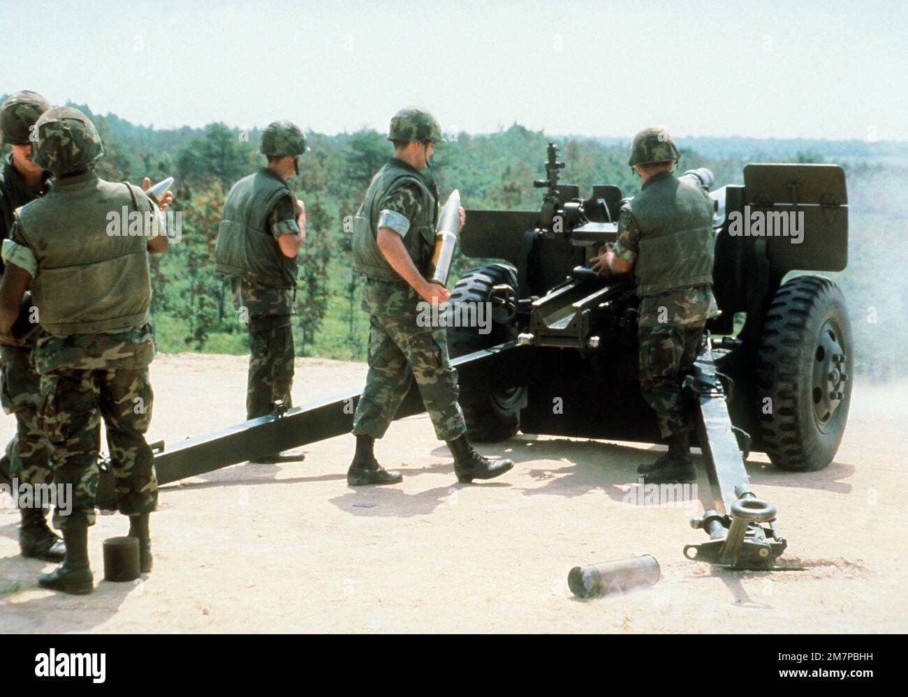 A right rear view of a 105mm howitzer gun section from the Artillery ...