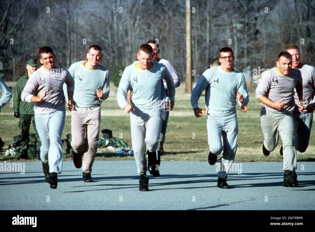 Marine officer candidates run during their daily physical training ...