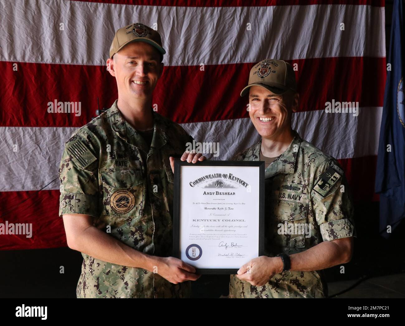 DARWIN, Australia (May 11, 2022) Cmdr. Keith Tate, left, 21st commanding officer of the forward ...