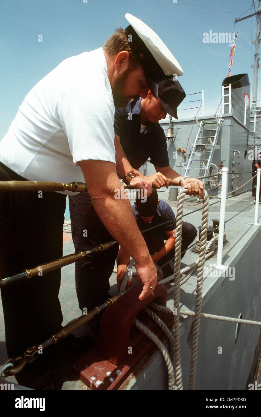 A petty officer instructs recruits aboard the training destroyer escort ...