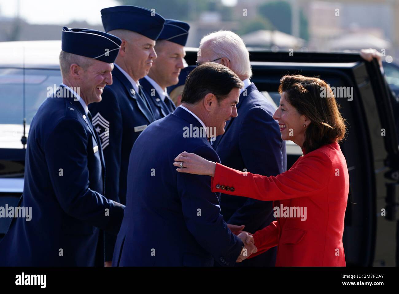 President Joe Biden greets members of the Air Force as Arizona Gov ...