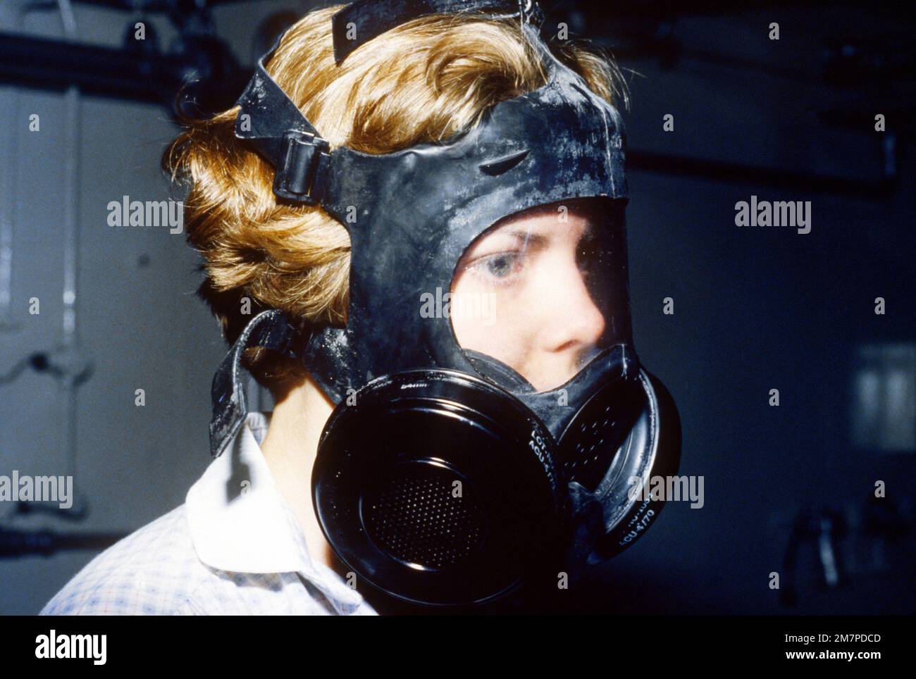 A female sailor wear a Mark IV, decontamination gear mask. Country ...