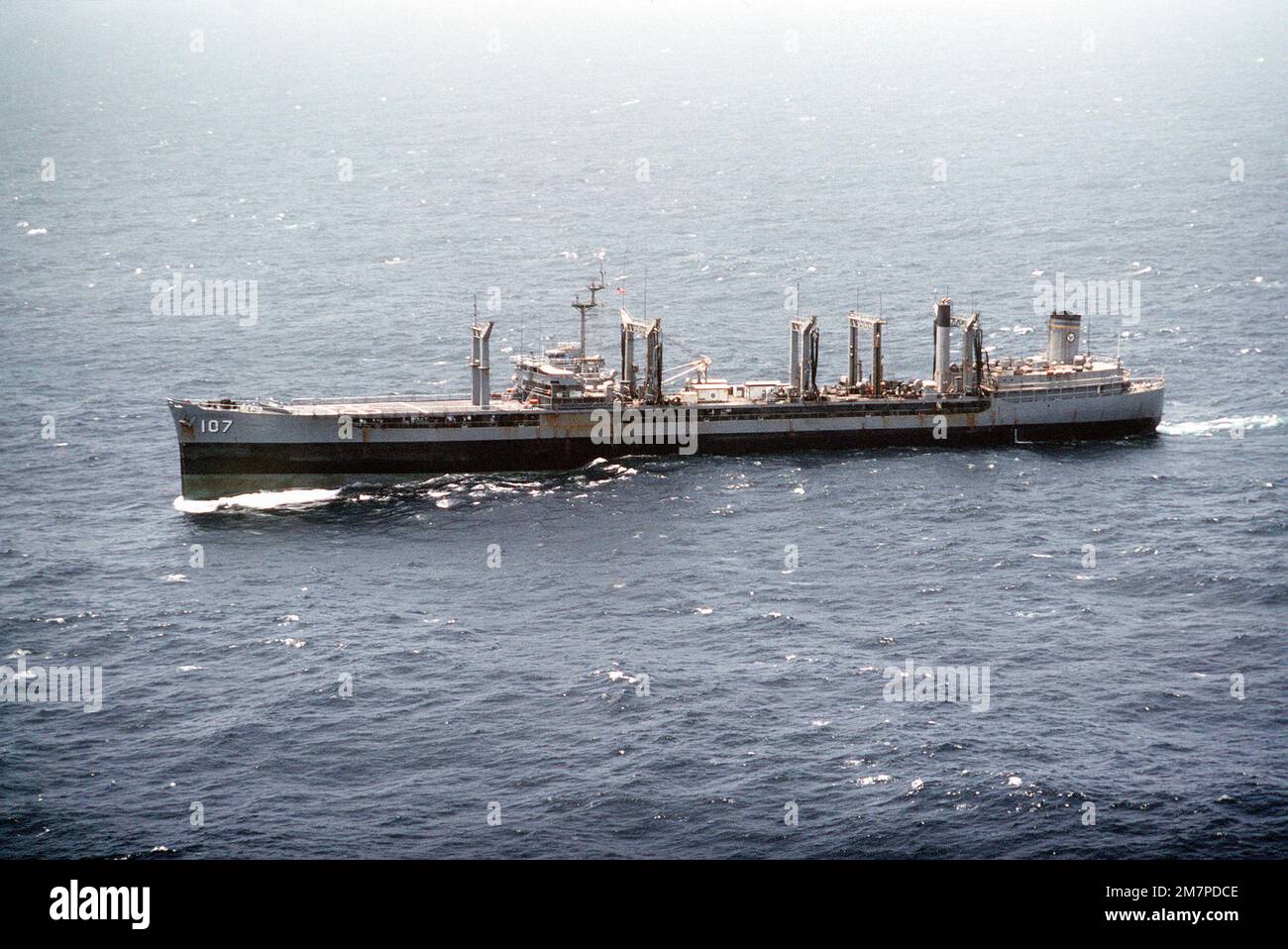 An aerial port beam view of the oiler USNS PASSUMPSIC (T-AO-107 ...