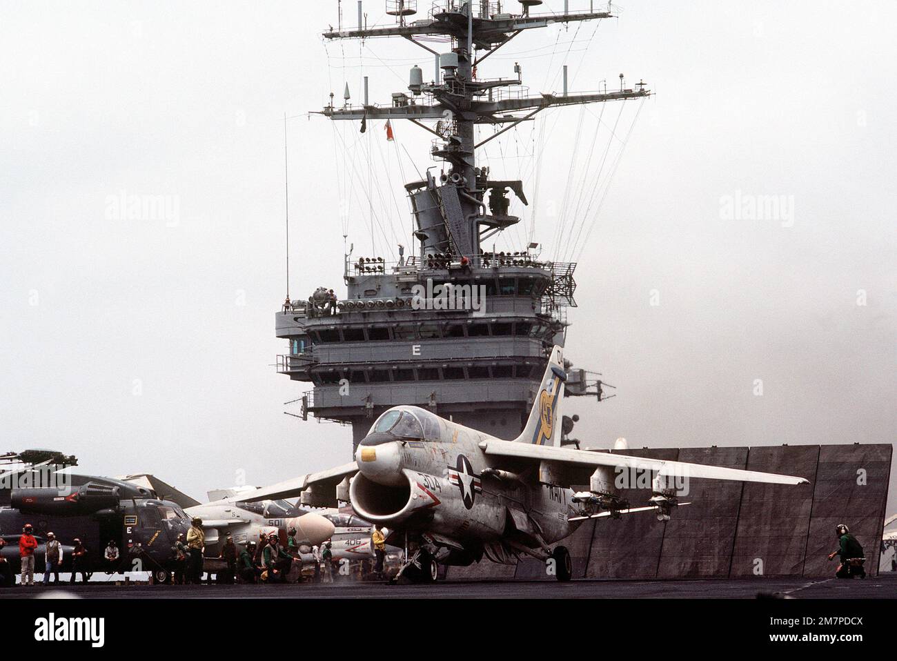 A left front view of an A-7 Corsair II aircraft preparing to launch ...