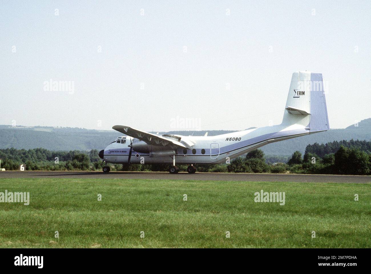 Left side view of a C-7 Caribou aircraft landing. Aboard are members of ...