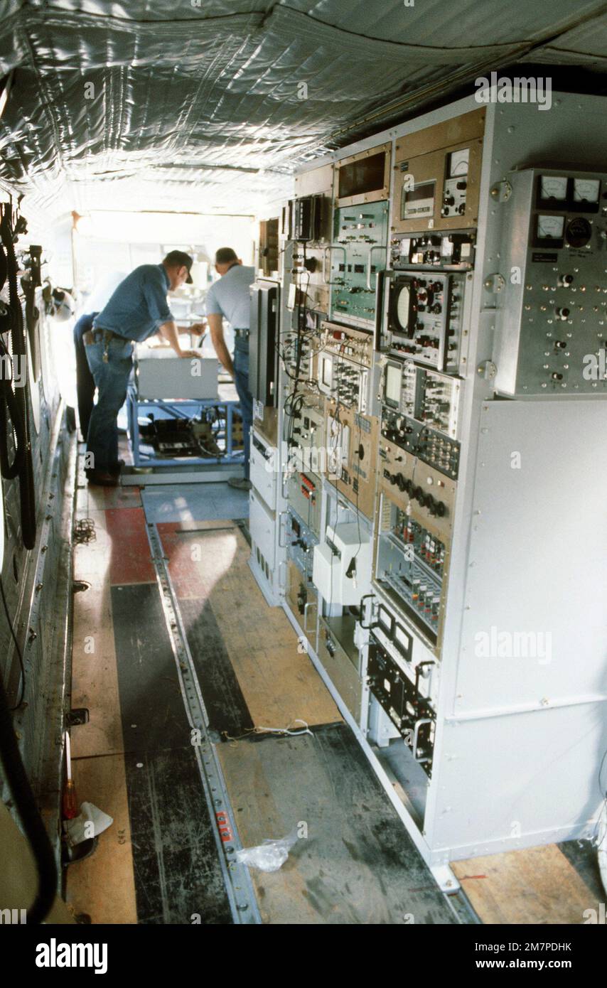 Interior view of a C-7 Caribou aircraft with civilian personnel from ...