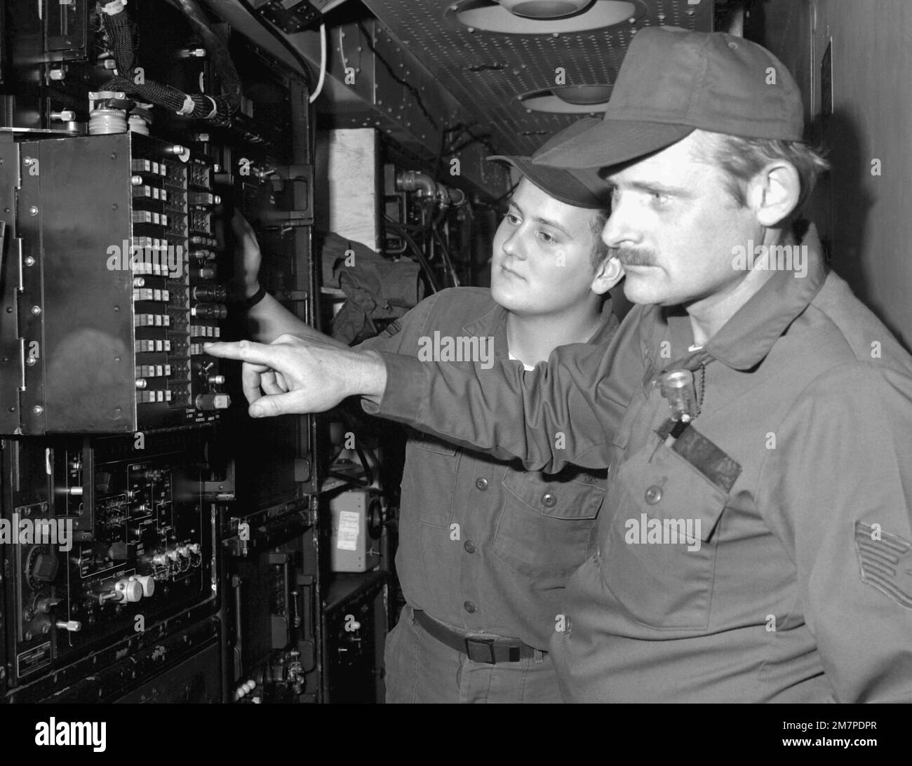 A radar maintenance technician explains functions of radar equipment to ...