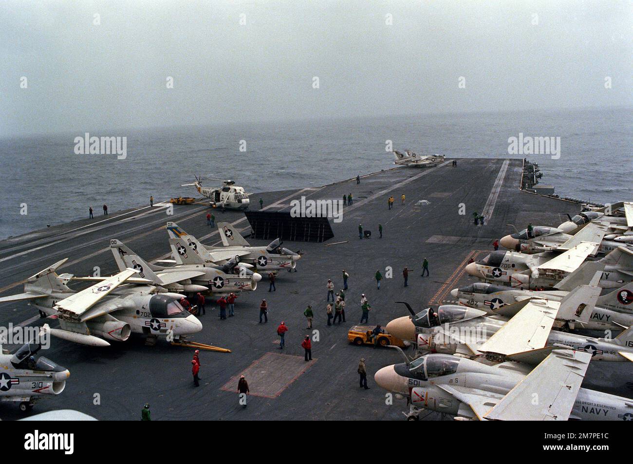 An elevated view of the forward section of the flight deck of the ...
