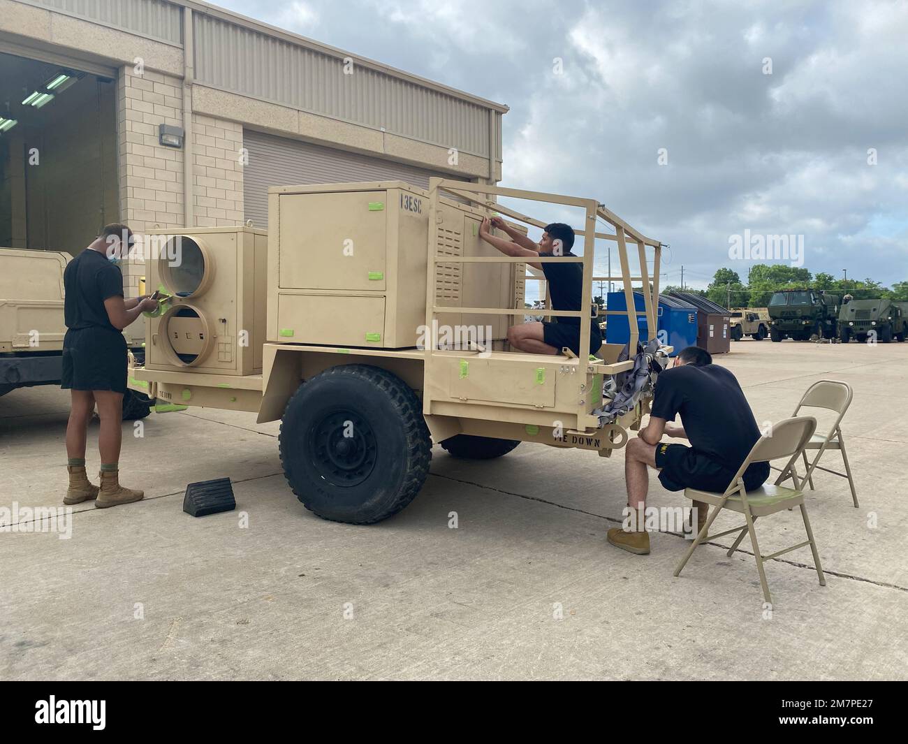 Soldiers from 13th Expeditionary Sustainment Command tape over parts ...