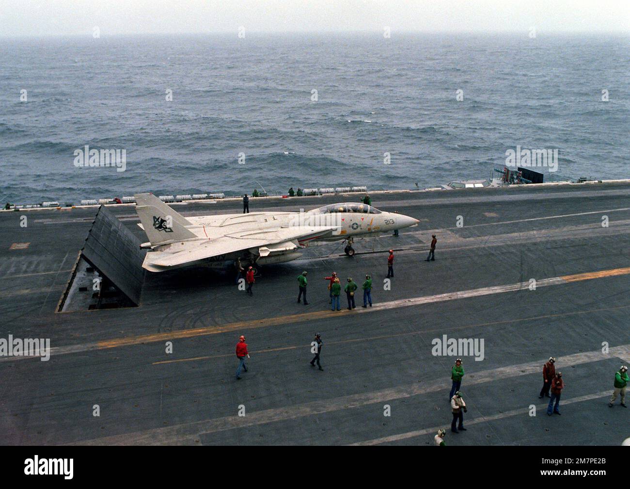 A left front view of a Fighter Squadron 142 (VF-142) F-14 Tomcat ...
