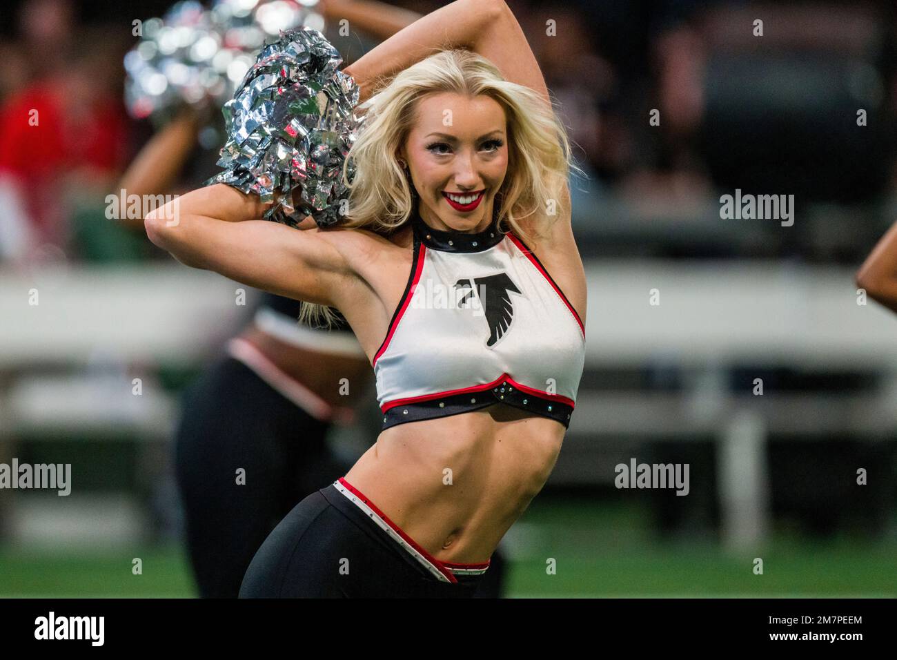 An Atlanta Falcons cheerleader performs before an NFL football game ...