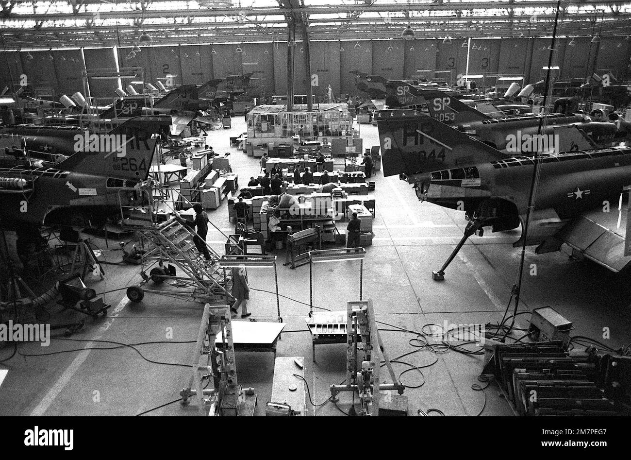 A view of F-4 Phantom II aircraft lined up for maintenance at the plant ...