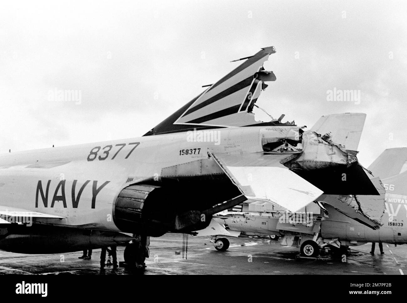 A view of the damaged tail section of an F-4J Phantom II aircraft on ...