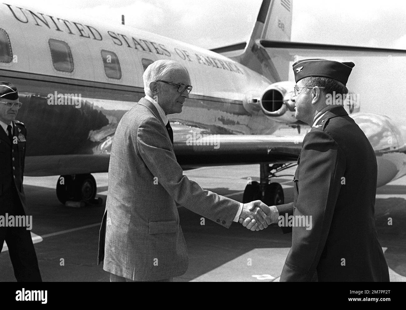 COL Benedict E. Glyphis, base commander, greets Thomas J. Watson, U.S ...