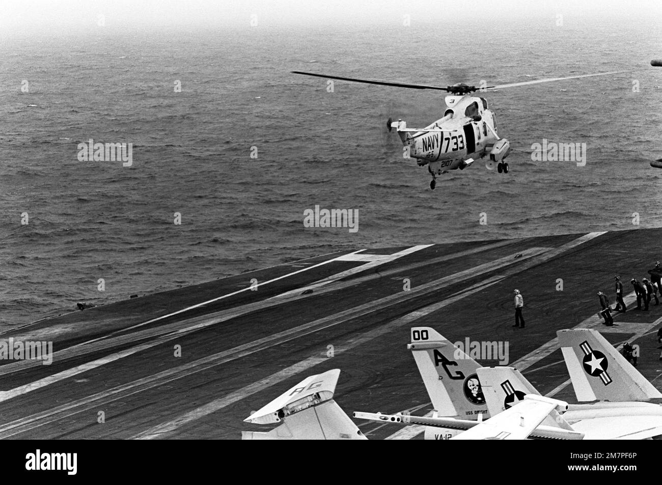 An SH-3 Sea King helicopter takes off from the flight deck during ...
