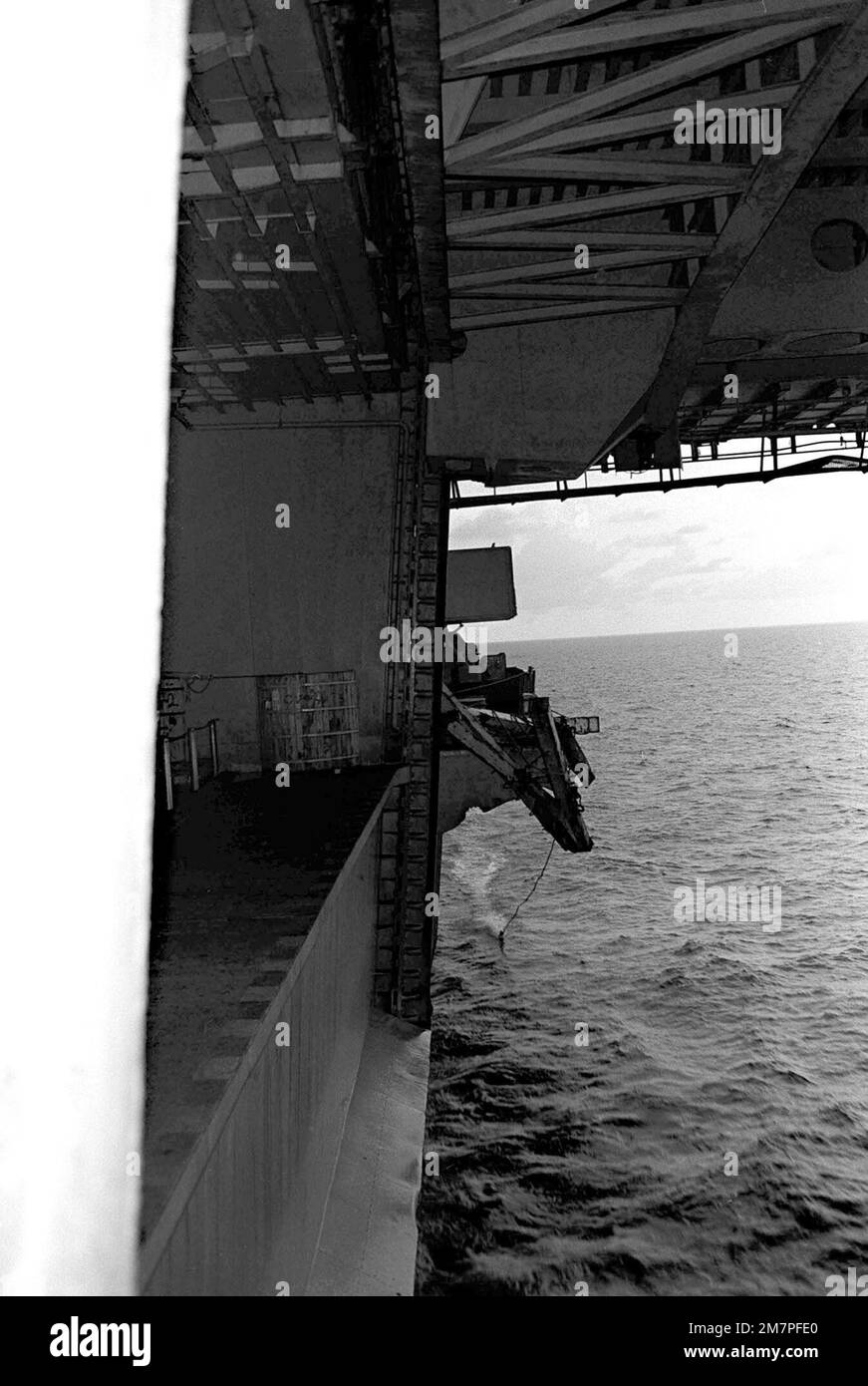 A view of damage resulting to the port aircraft elevator of the ...
