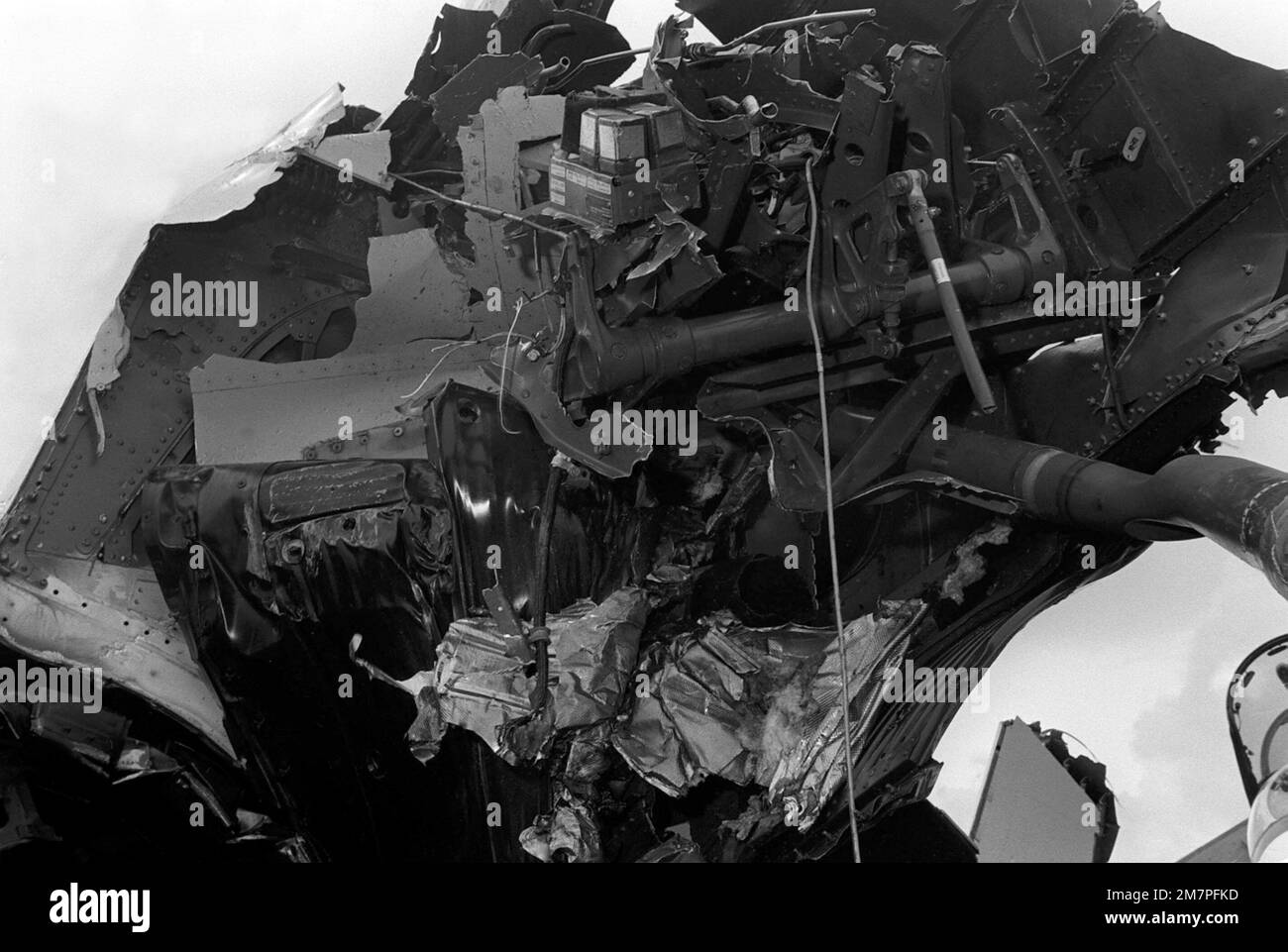 A view of damage caused to an aircraft aboard the aircraft carrier USS ...