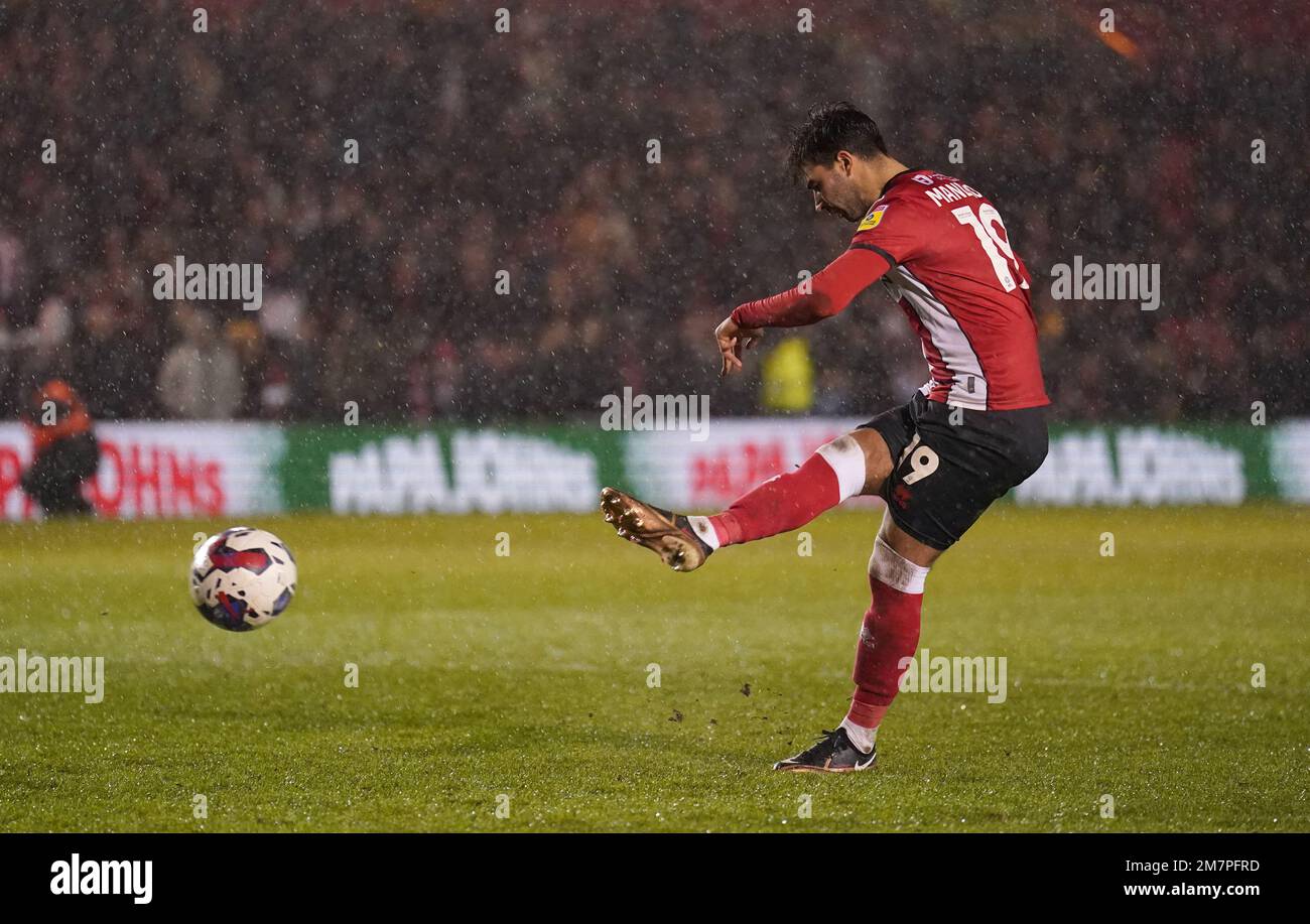Lincoln City's Daniel Mandroiu has his penalty saved in the shoot-out ...