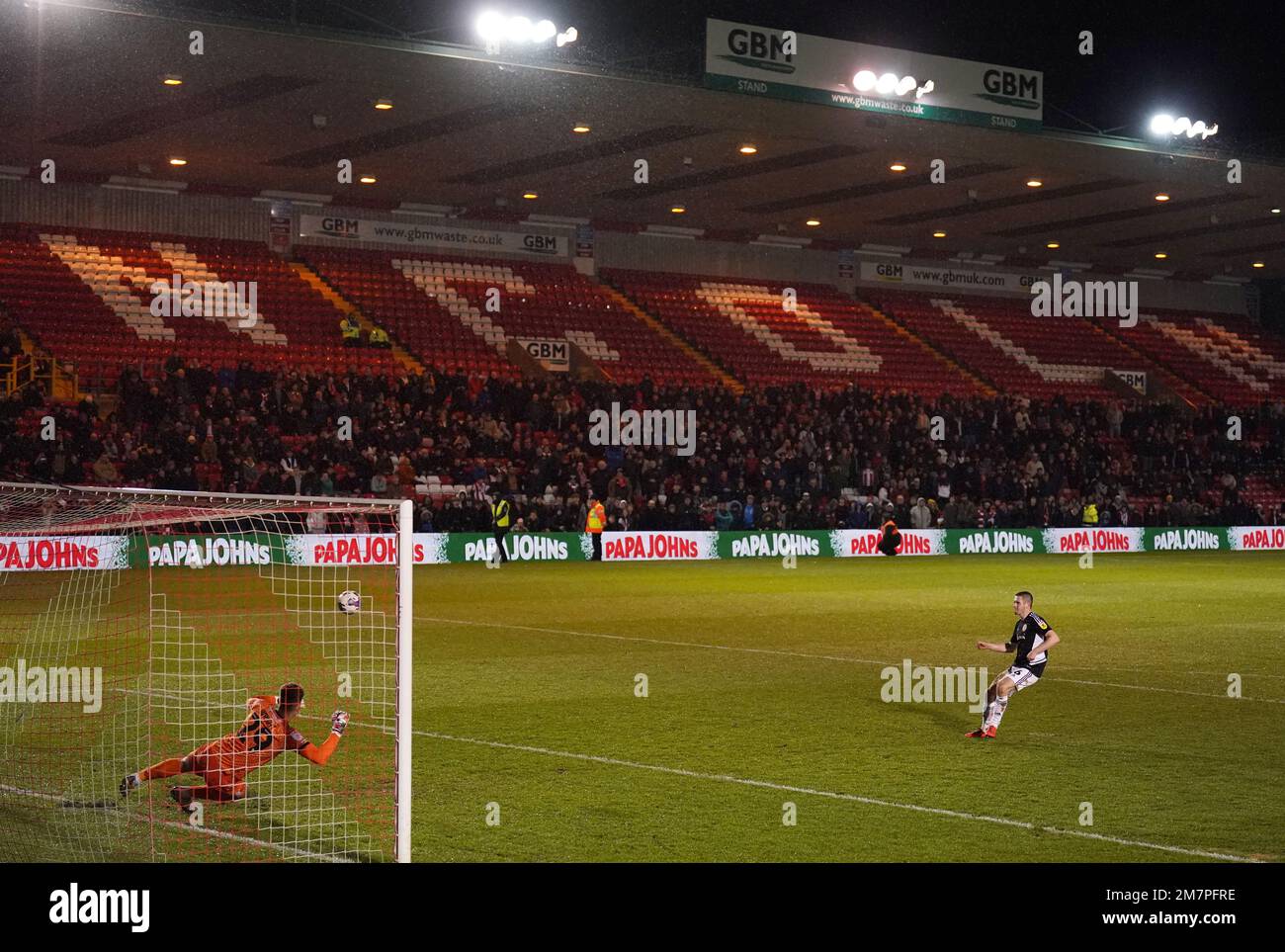 Accrington Stanley's Liam Coyle scores in the shoot-out during the Papa ...