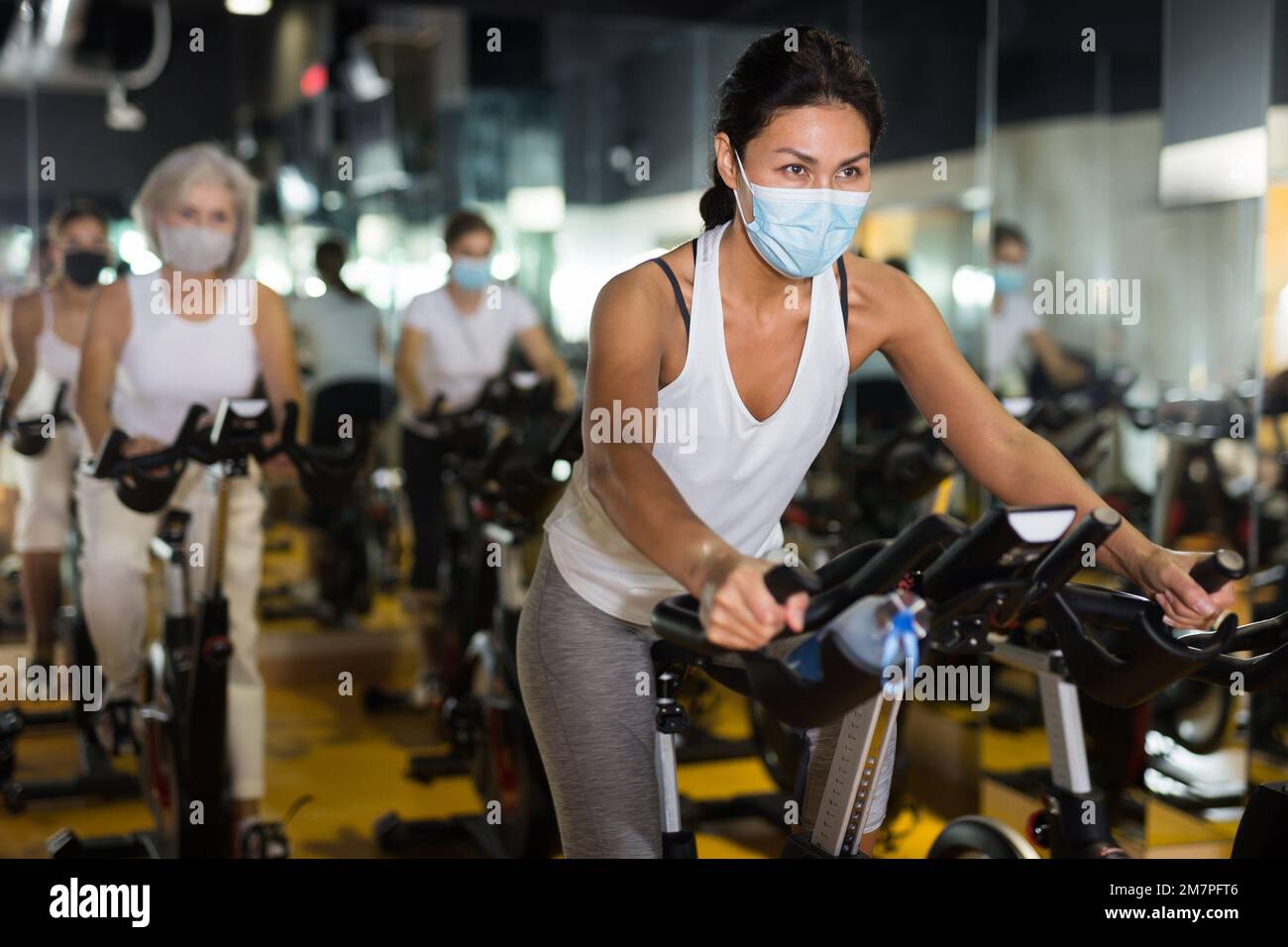 Focused woman wearing face mask hi-res stock photography and images - Alamy