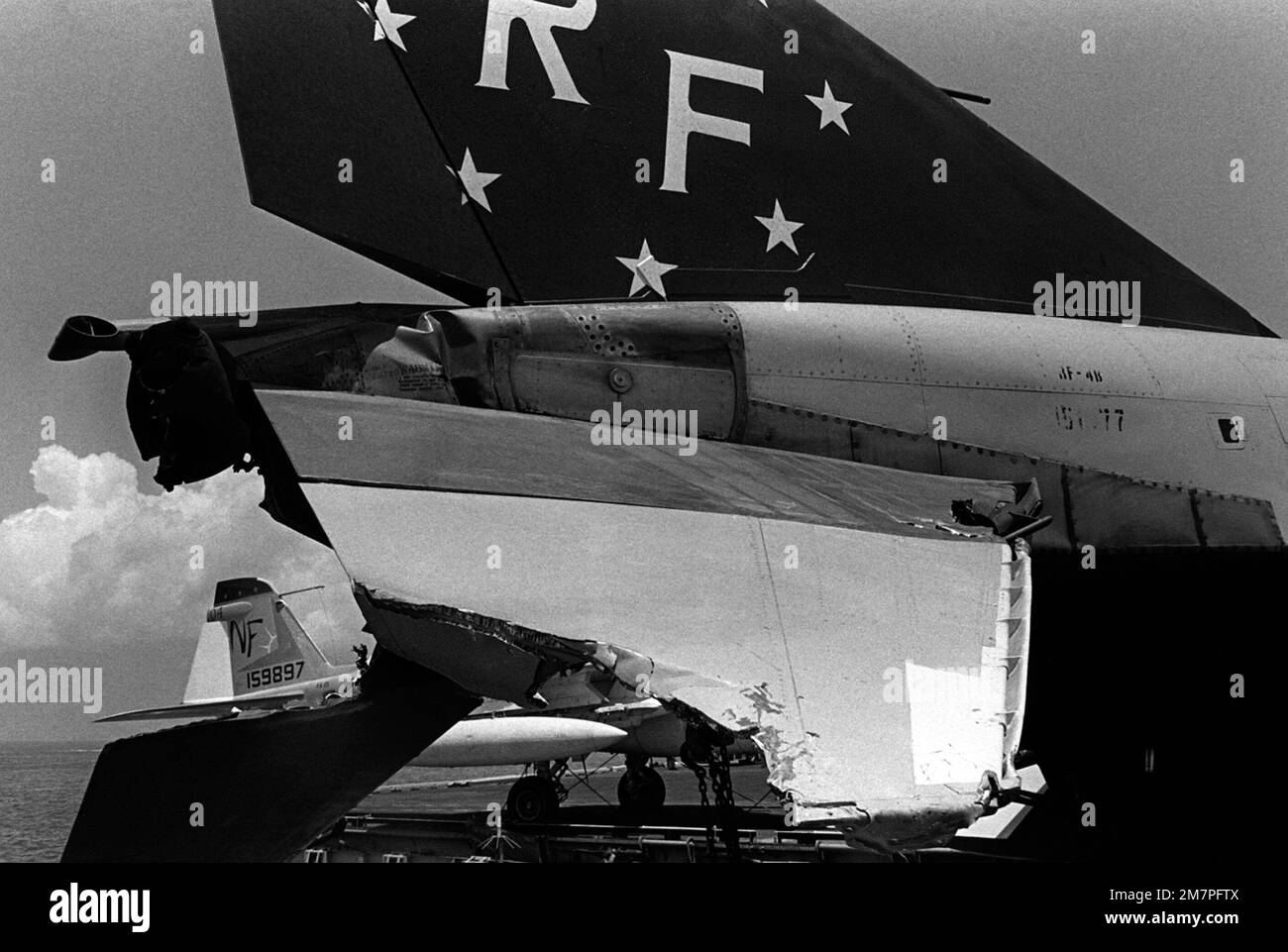 A view of damage caused to the tail section of an F-4 Phantom II ...