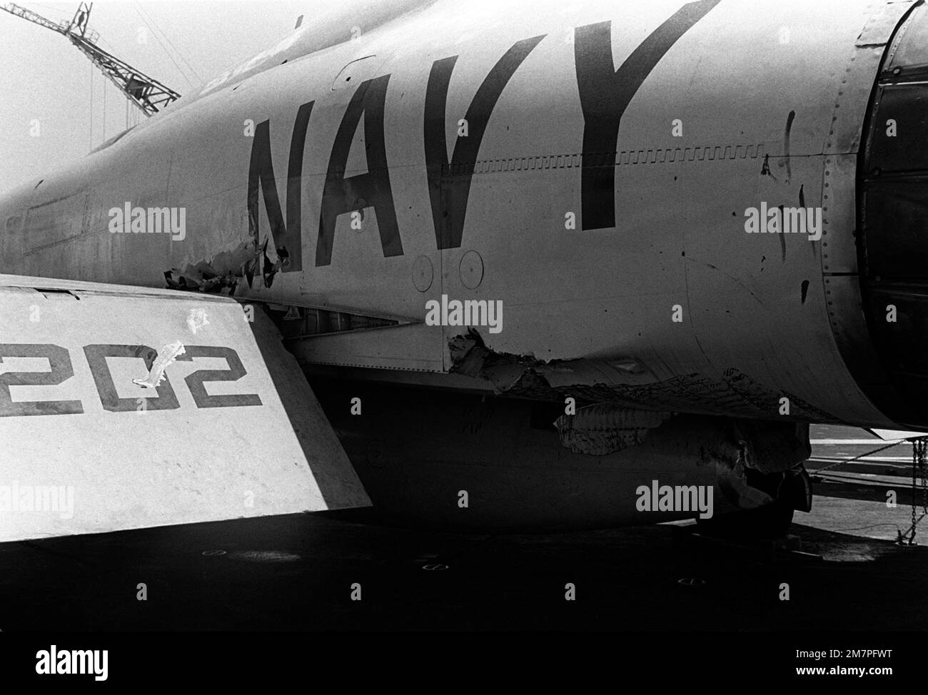 A view of damage caused to the tail section of an F-4 Phantom II ...