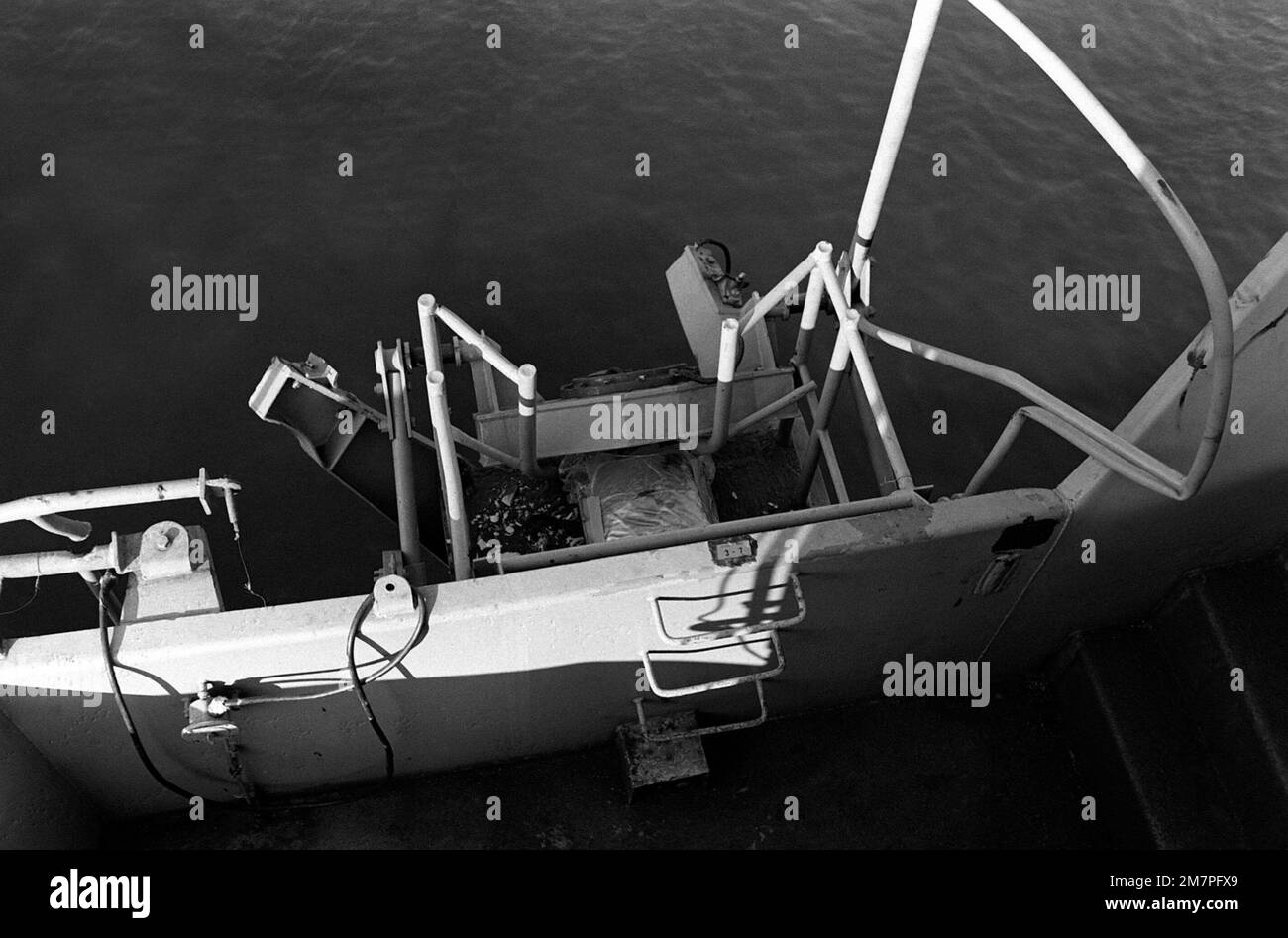 A view of damage caused to the port side of the aircraft carrier USS ...