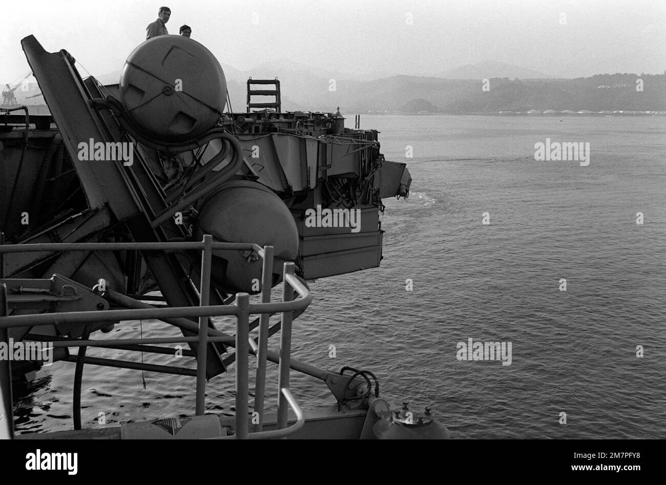 A view of damage caused to the port side of the aircraft carrier USS ...