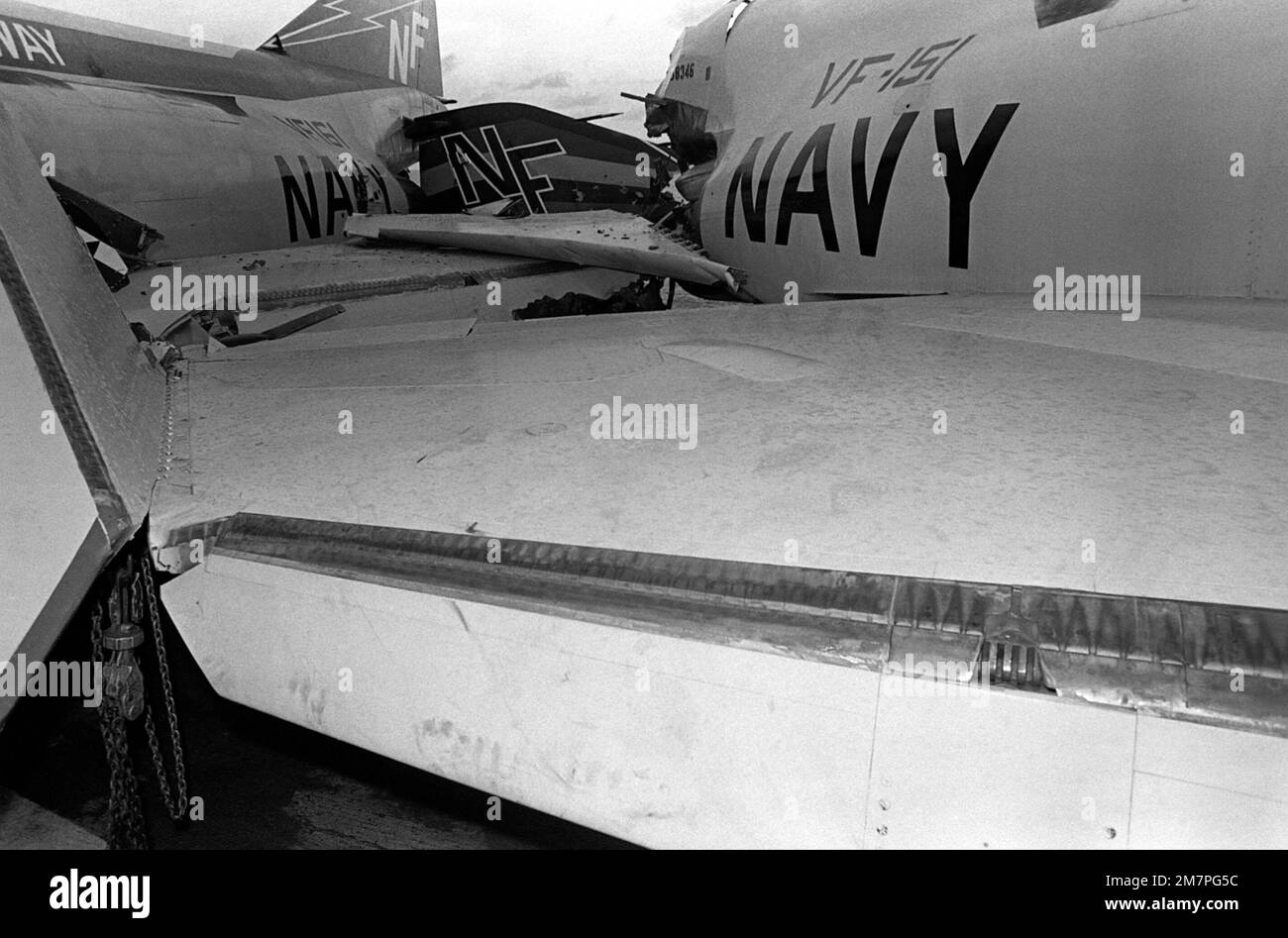 A view of damage caused to two F-4 Phantom II aircraft that were parked ...