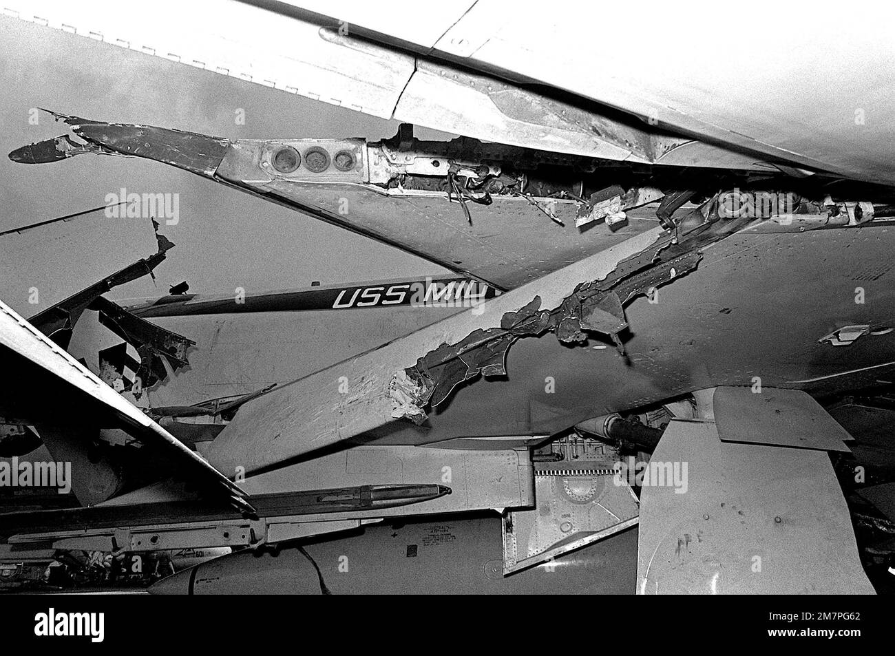 A view of damage caused to an F-4 Phantom II aircraft that was parked ...