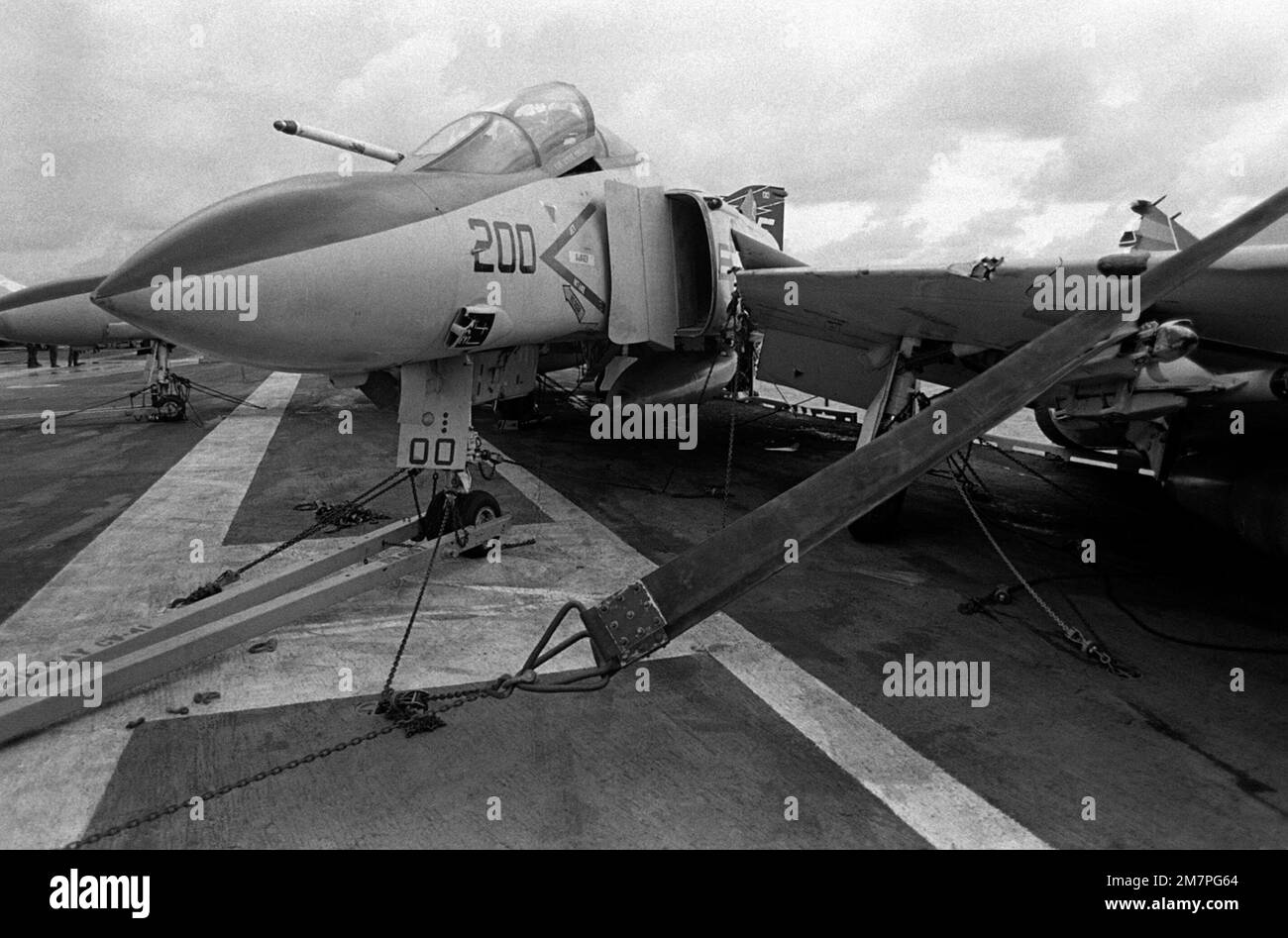 A view of damage caused to two F-4 Phantom II aircraft that were parked ...