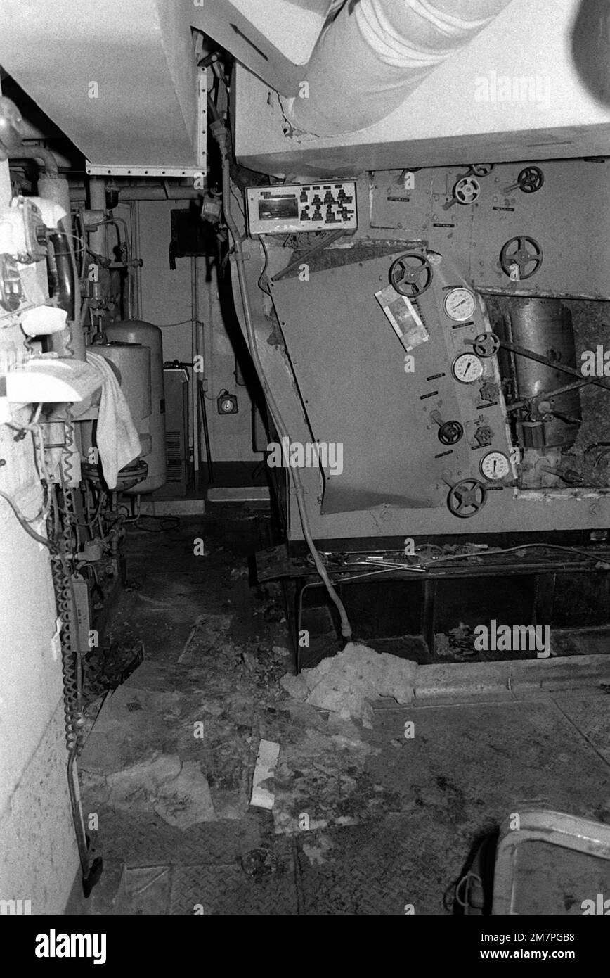 An interior view of damage caused to the aircraft carrier USS MIDWAY ...