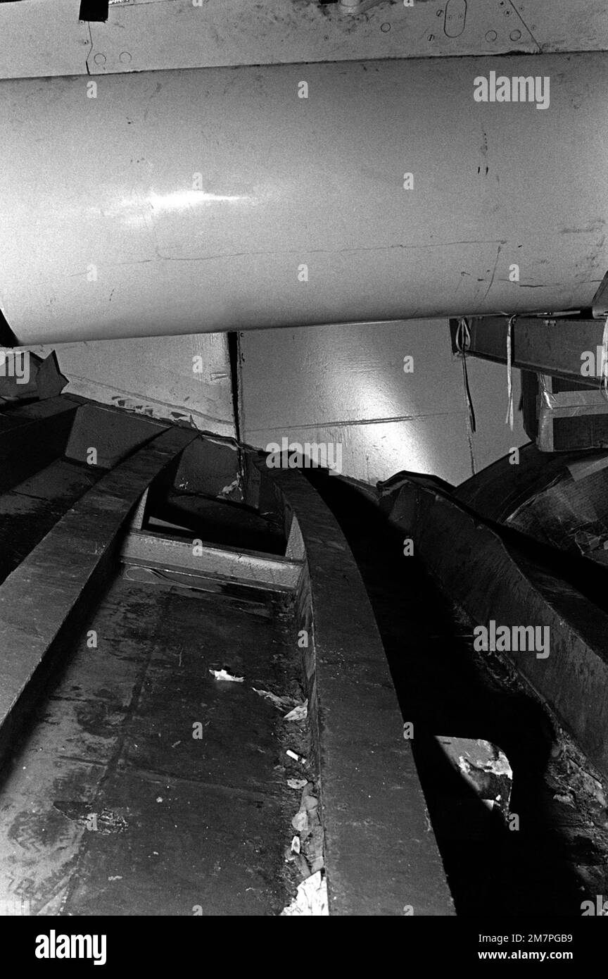 An interior view of the damage caused to the aircraft carrier USS ...