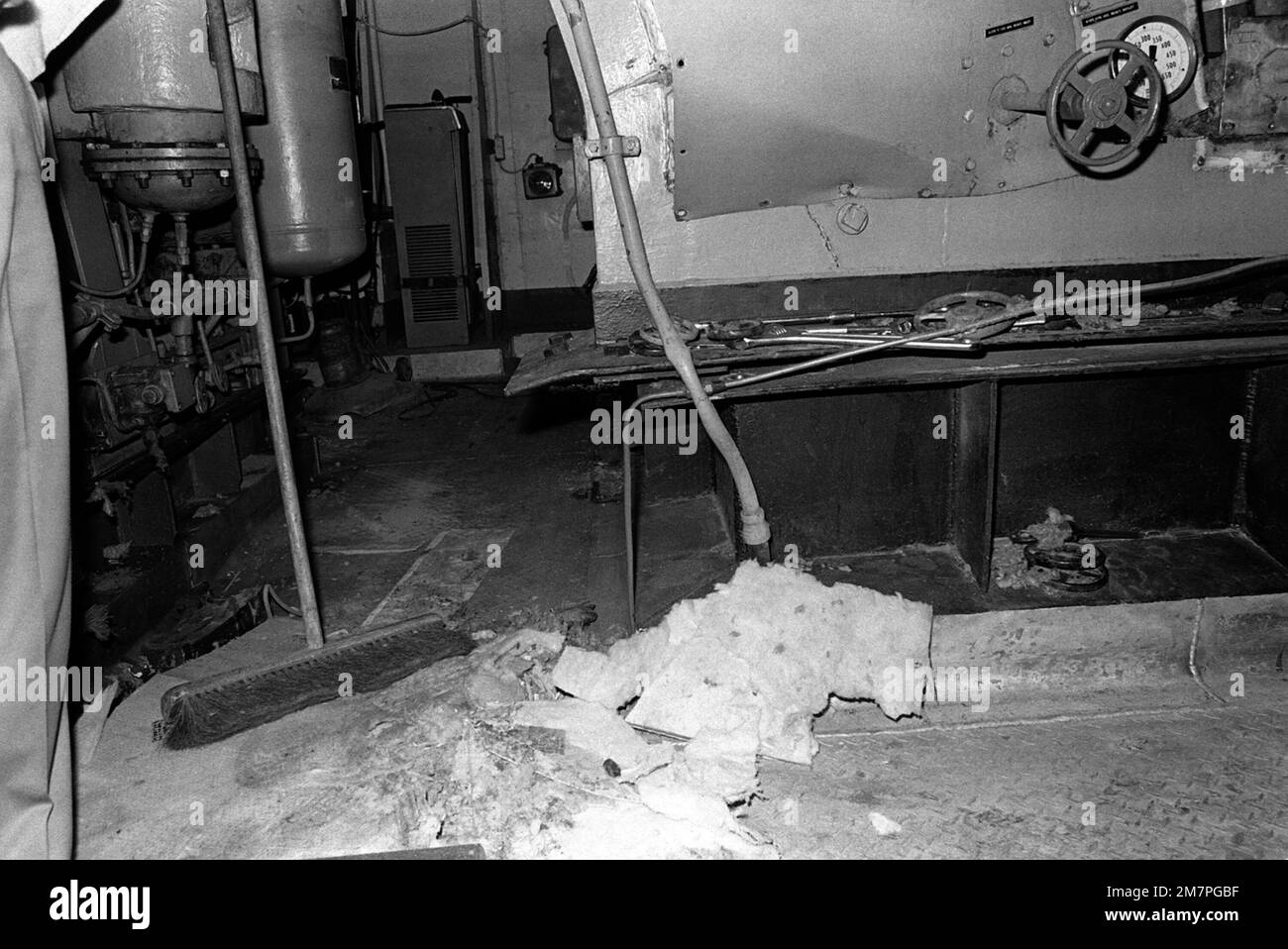An interior view of damage caused to the aircraft carrier USS MIDWAY ...