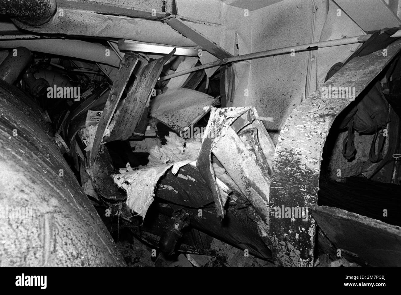 An interior view of damage caused to the aircraft carrier USS MIDWAY ...