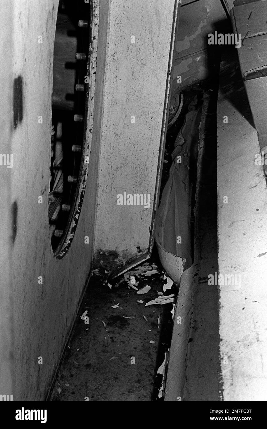An interior view of damage caused to the aircraft carrier USS MIDWAY ...