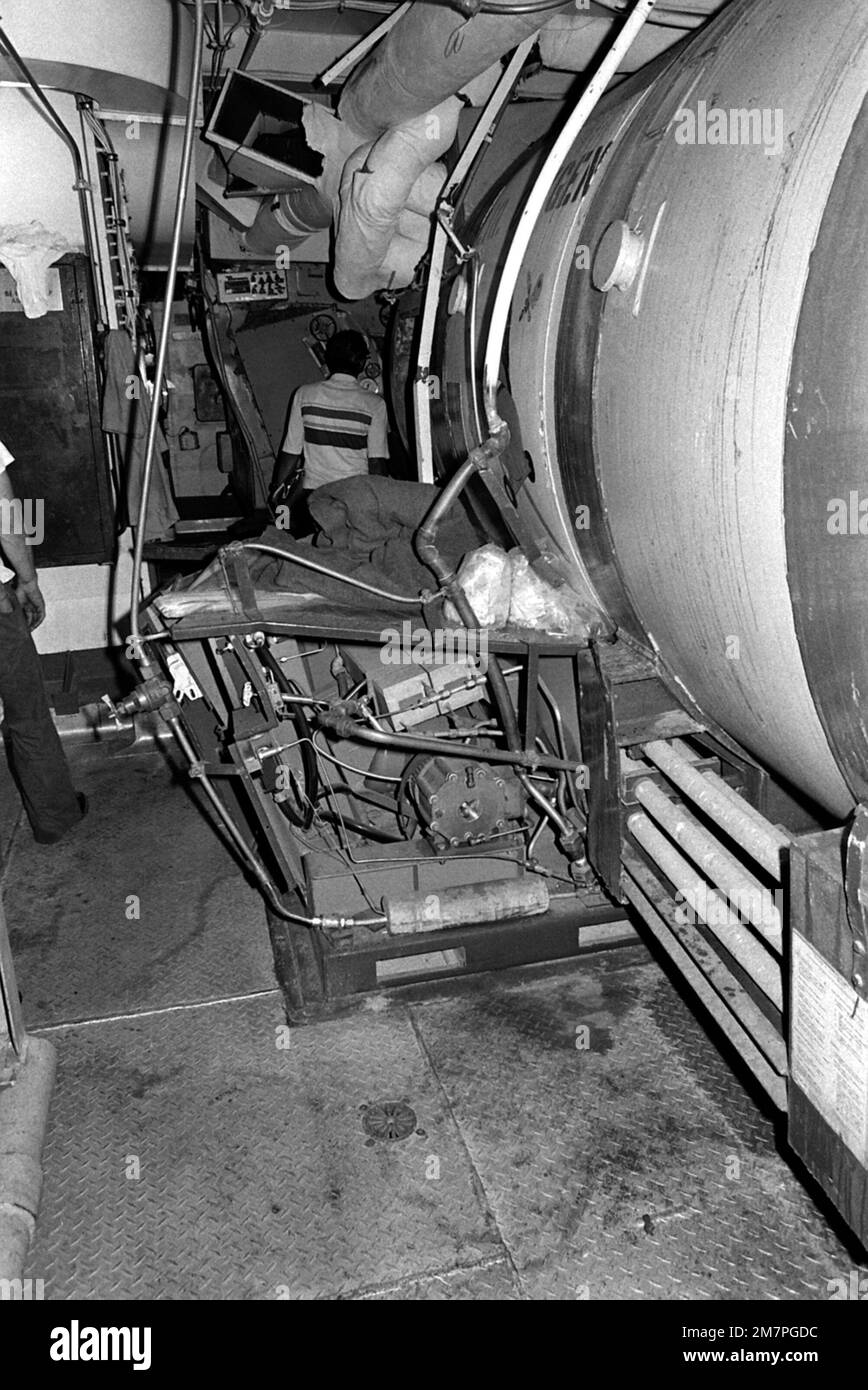 An interior view of damage caused to the aircraft carrier USS MIDWAY ...