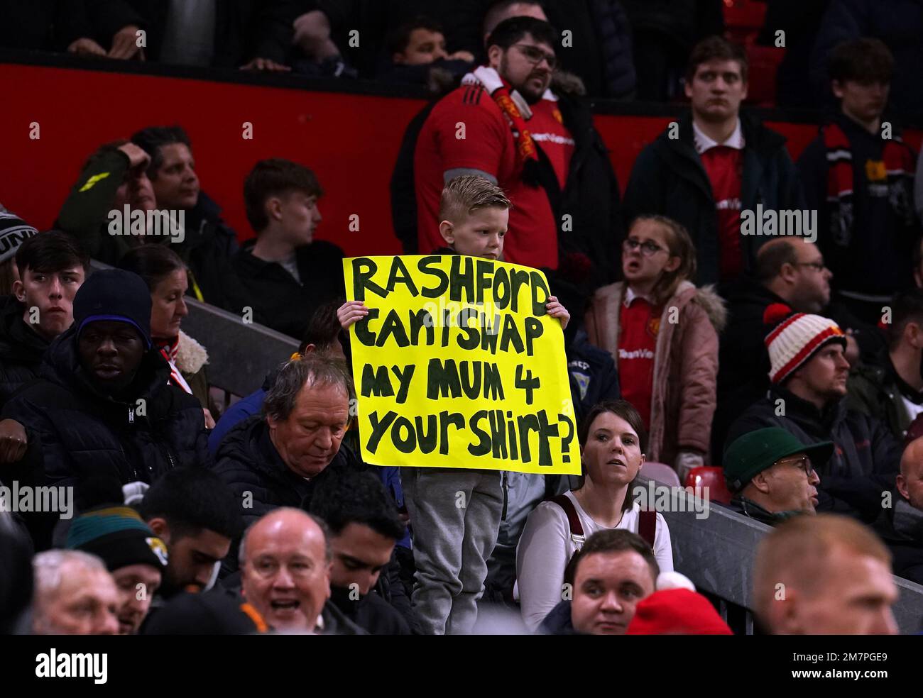 A Manchester United fan holds up a sign which reads Rashford can I swap ...