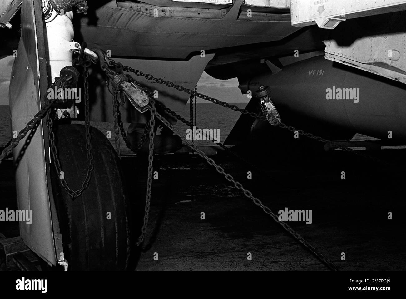 A close-up view of chains securing an aircraft to the flight deck of ...