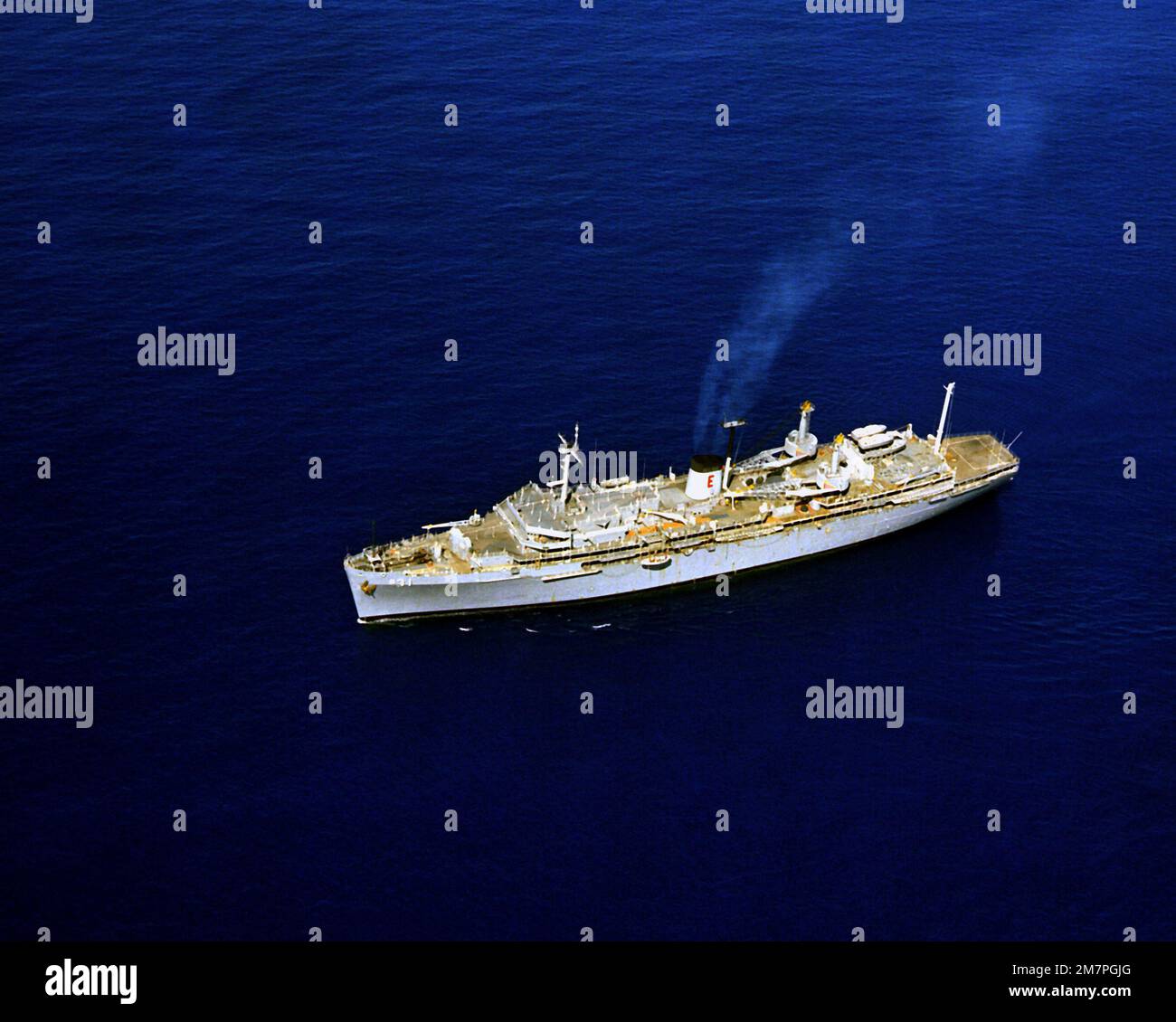 A port view of the submarine tender USS HUNLEY (AS-31) underway. Base ...