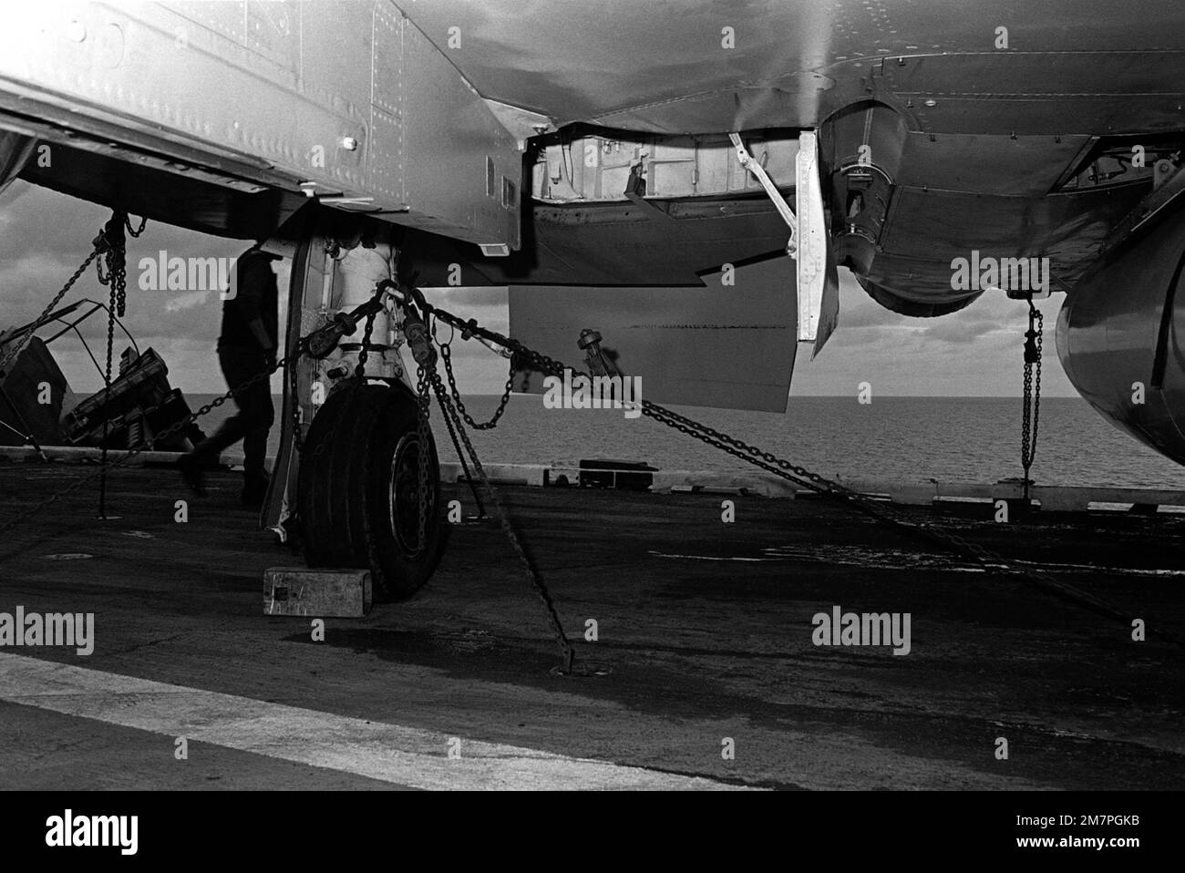 A close-up view of chains securing an aircraft to the flight deck of ...