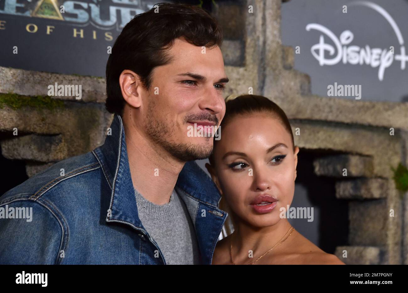 Gleb Savchenko, left, and Elena Belle arrive at a red carpet event for "National Treasure: Edge ...