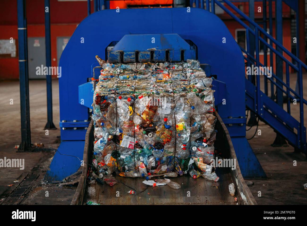 Modern waste processing plant. Pressed and packed plastic bottles Stock ...
