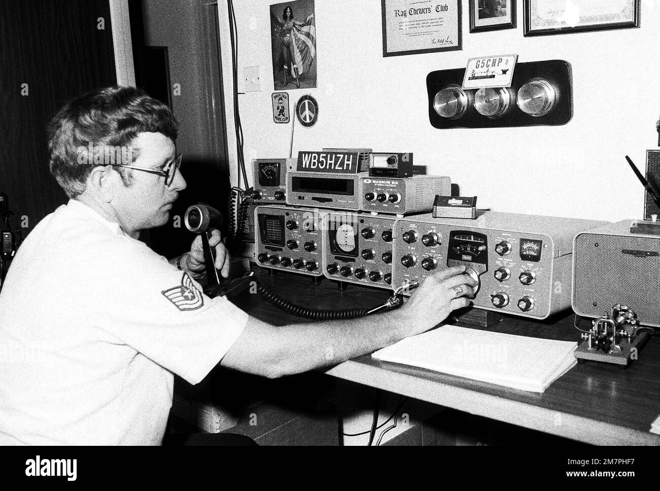 A wing job controller sets his ham radio. The controller, assigned to ...
