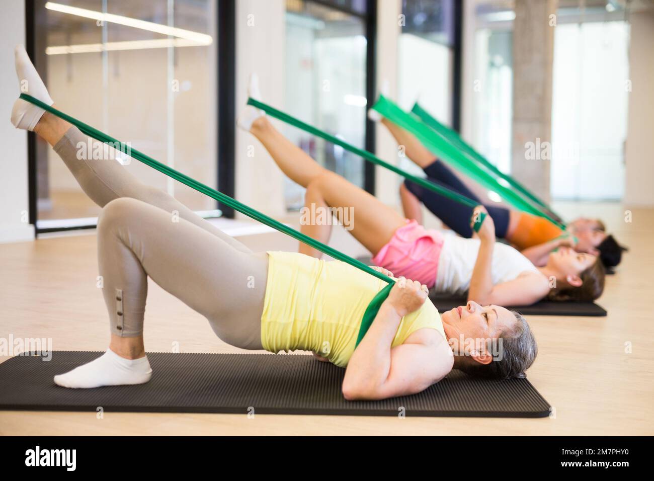 Group of women doing stretch exercises Stock Photo - Alamy