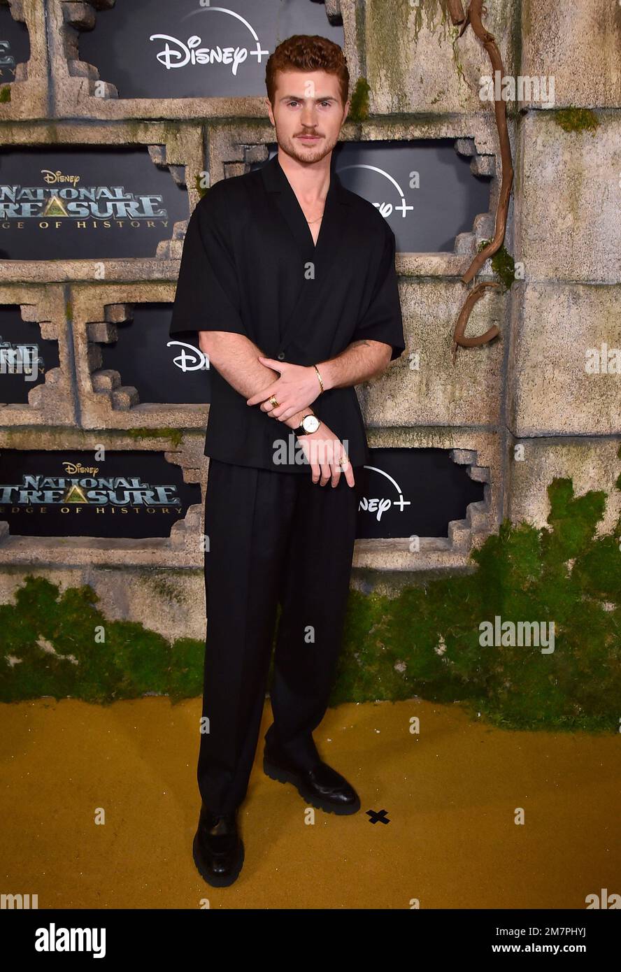 Jake Austin Walker arrives at a red carpet event for "National Treasure ...