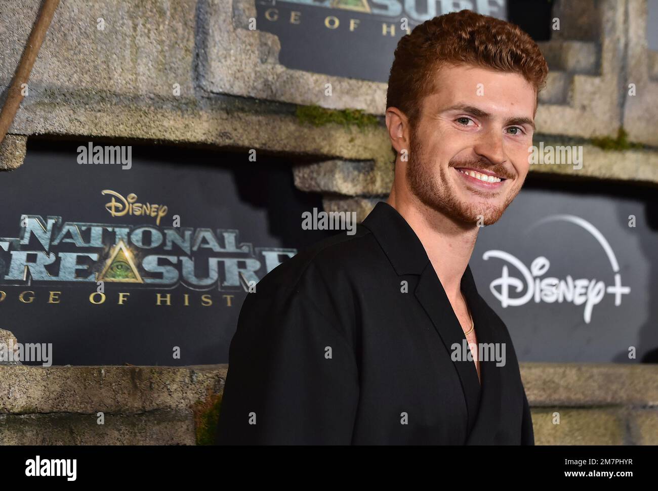 Jake Austin Walker arrives at a red carpet event for "National Treasure ...