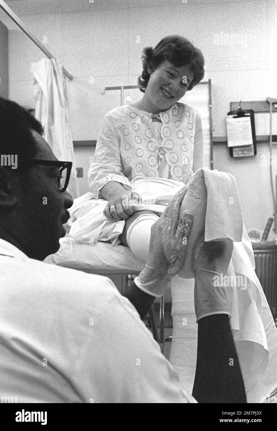 A U.S. Air Force orthopedic technician puts a protective sock over a ...